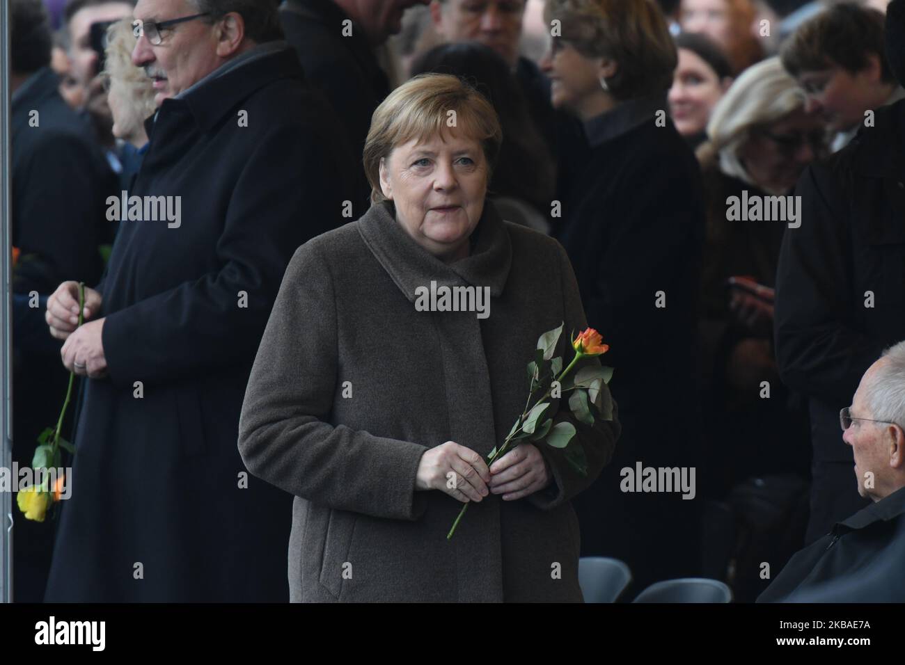 Angela Merkel, Chancellor of Germany, arrives with a rose in her hand ...