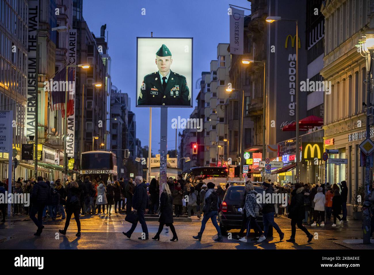Tourists visit the Checkpoint Charlie in Berlin, Germany on November 9 ...