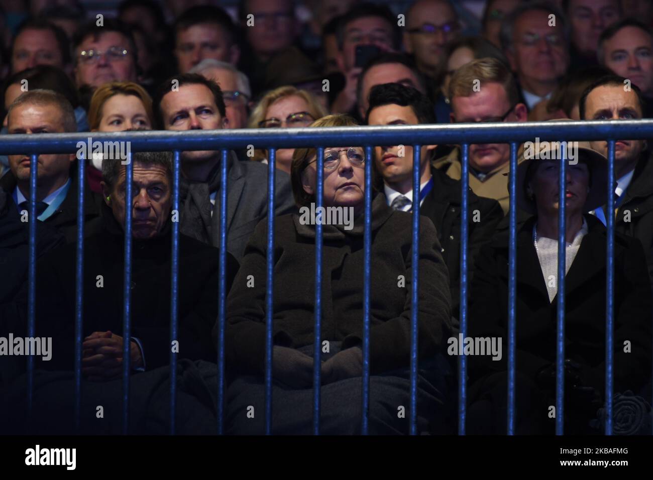 Angela Merkel (Center), Chancellor of Germany, watches the eveing show ...