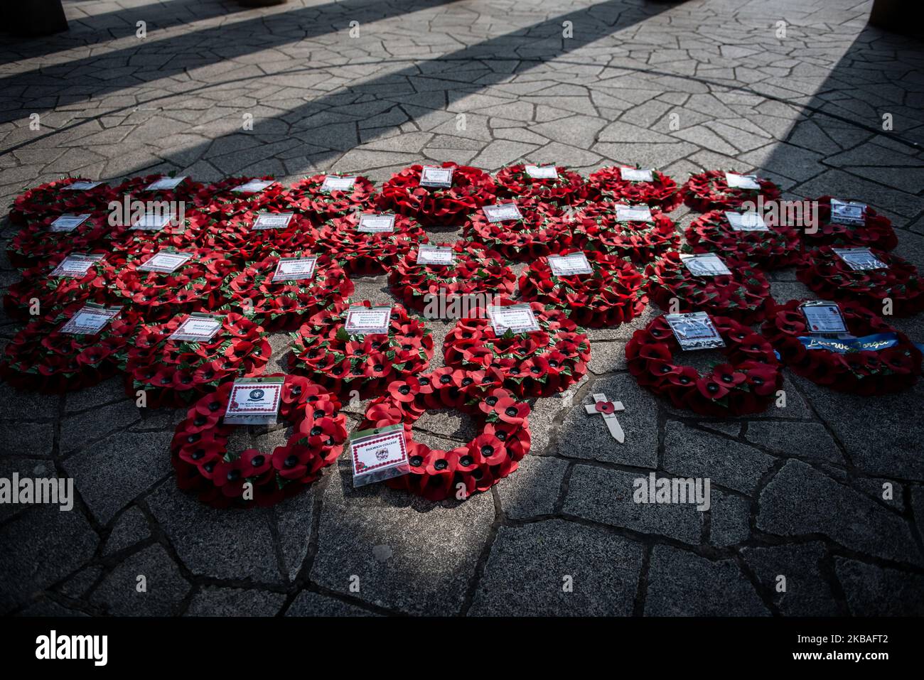 Poppy wreaths are pictured on the floor during the Remembrance Day ...