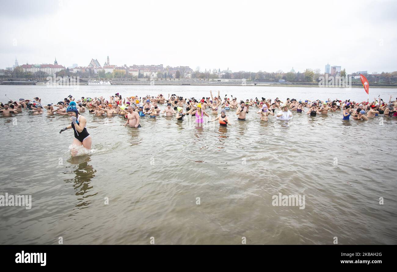 People taking a bath in the cold Vistula river, in Warsaw, Poland, on ...