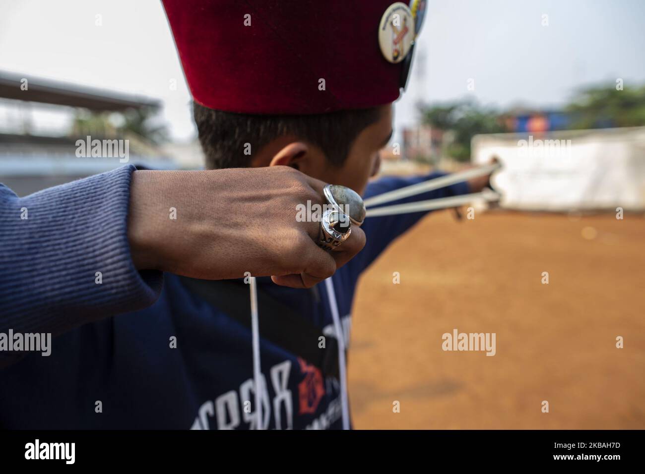 A participant aim his slingshot bullet to the target in Jakarta ...