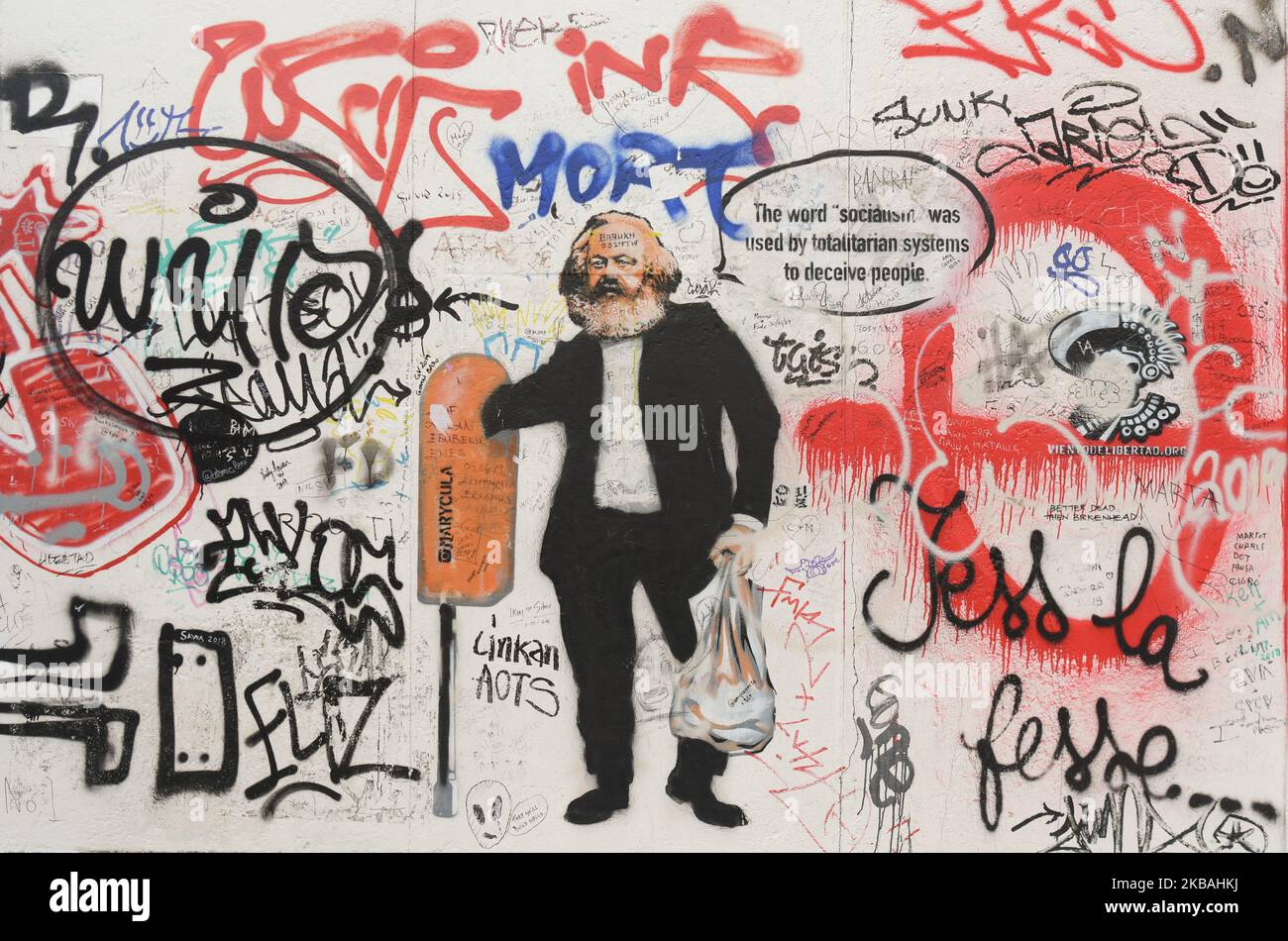 A graffiti of Karl Marx seen on a still-standing section of the former ...