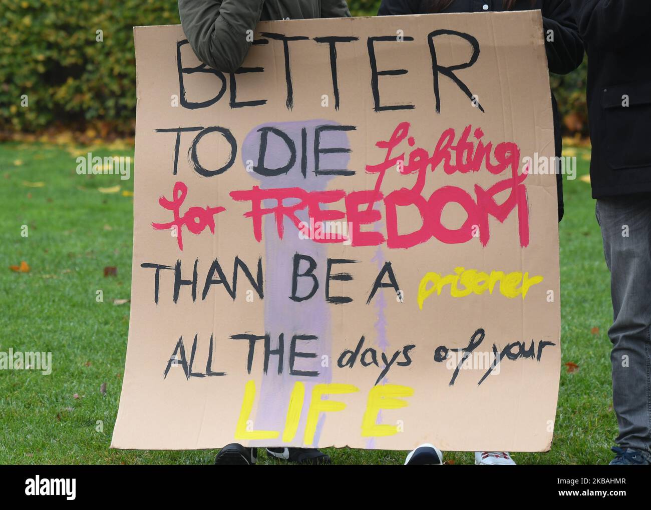 A young activist holds 'Better To Die Fighting For Freedom Then Be A ...