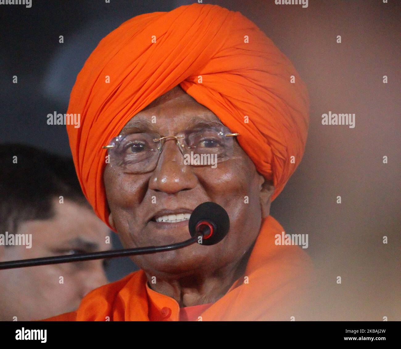 Social activist Swami Agnivesh smiles during a religious event to ...
