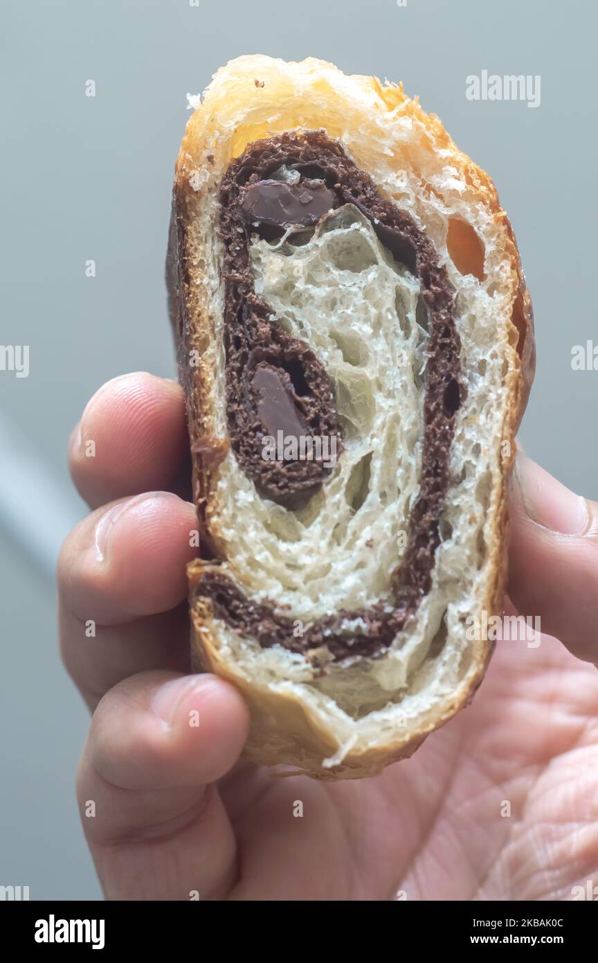 Pain au Chocolat cut in half and showing the inside with natural light ... Pain au Chocolat cut in half and showing the inside with natural light ...