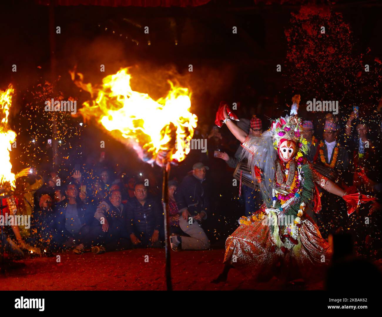 A Nepalese artist clad as a deity performing a traditional dance during ...