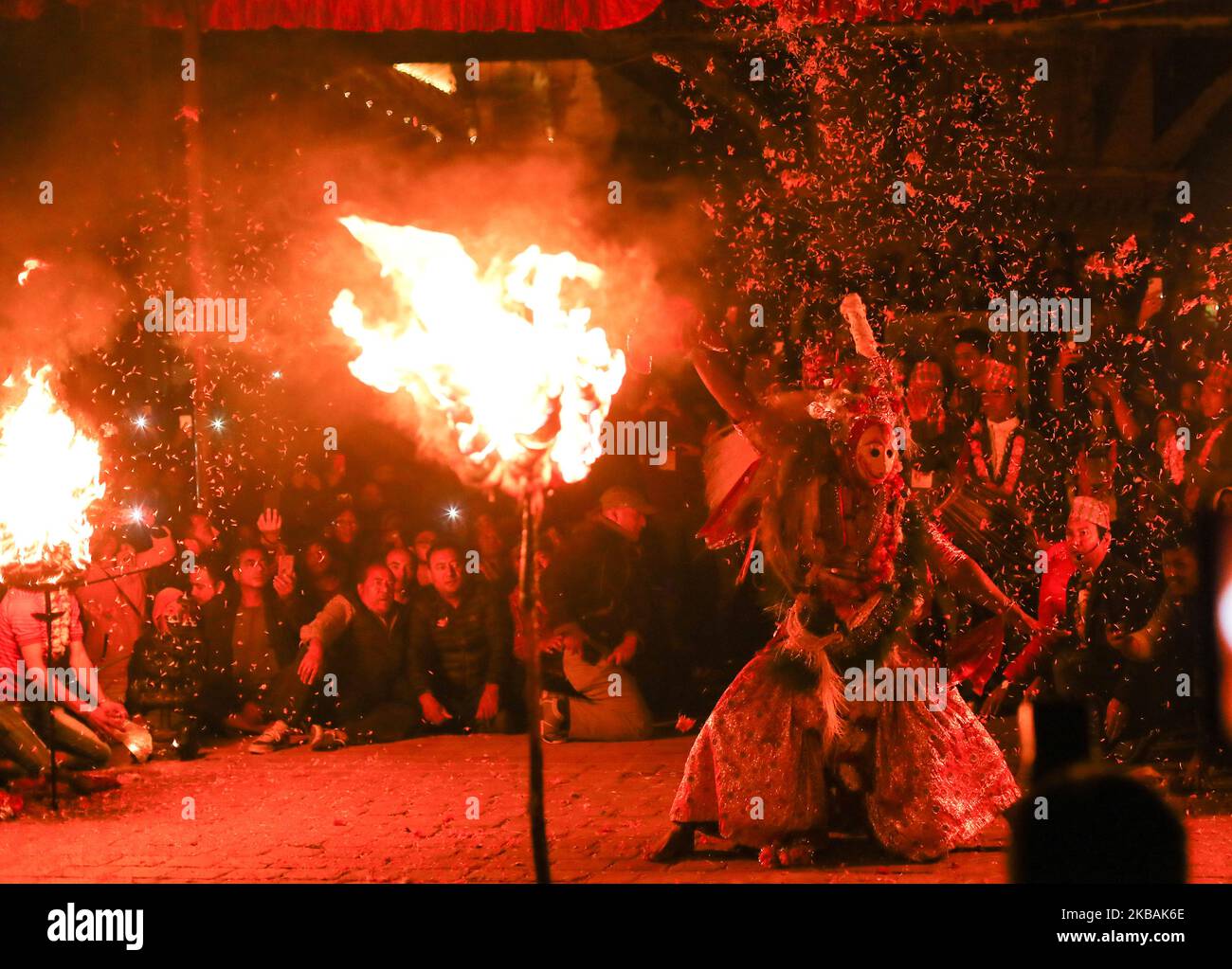 A Nepalese artist clad as a deity performing a traditional dance during ...