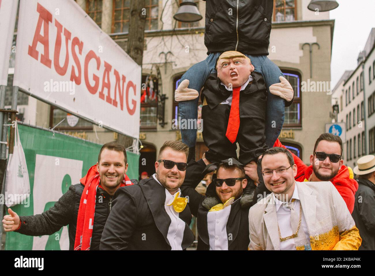 group of men pose for the camera on the first day of carnival on 11 ...