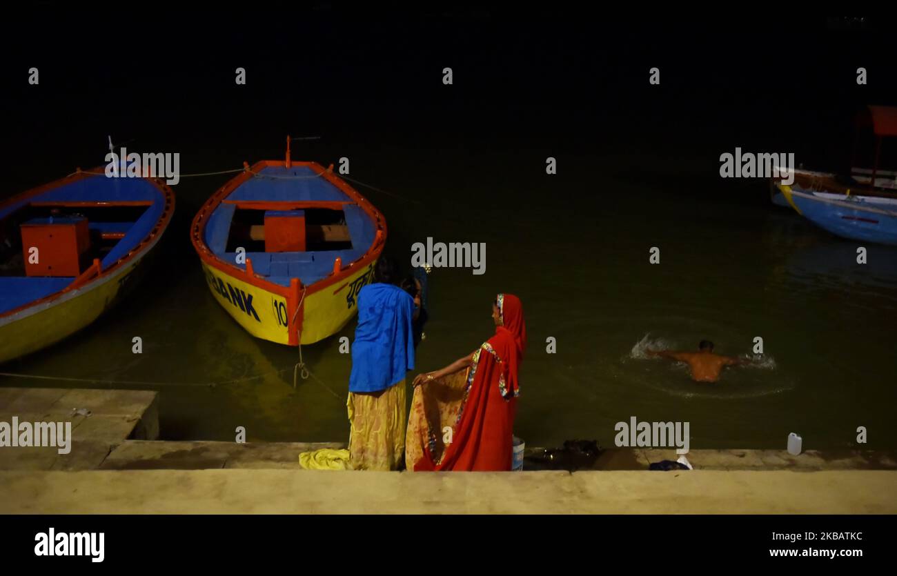 Hindu devotees bath on the day of Dev Deepawali in Varanasi, India, 12 ...