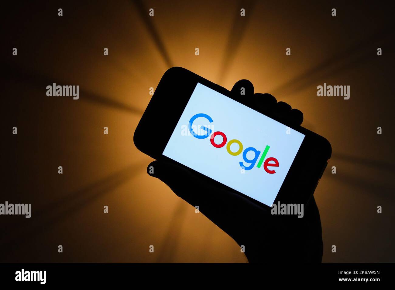 Google logo is seen displayed on a phone screen in this illustration ...