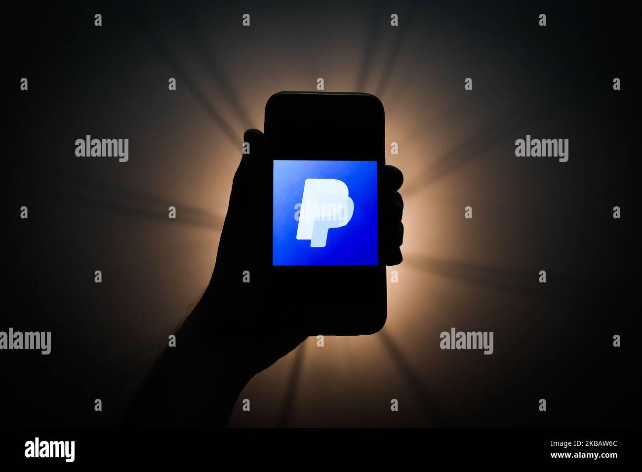 PayPal logo is seen displayed on a phone screen in this illustration ...