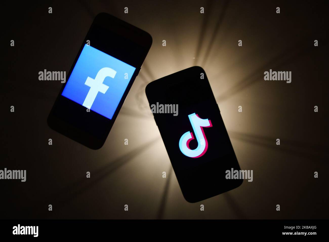 Facebook and Instagram logos are seen displayed on a phone screens in ...