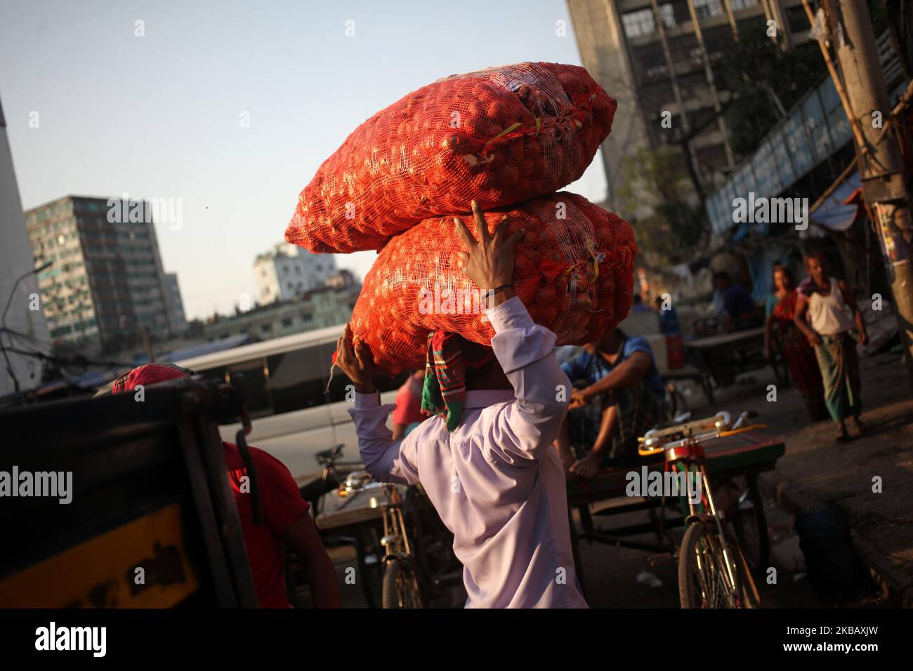 Worker seen unloading onion from a mini truck as onion prices shot past ...