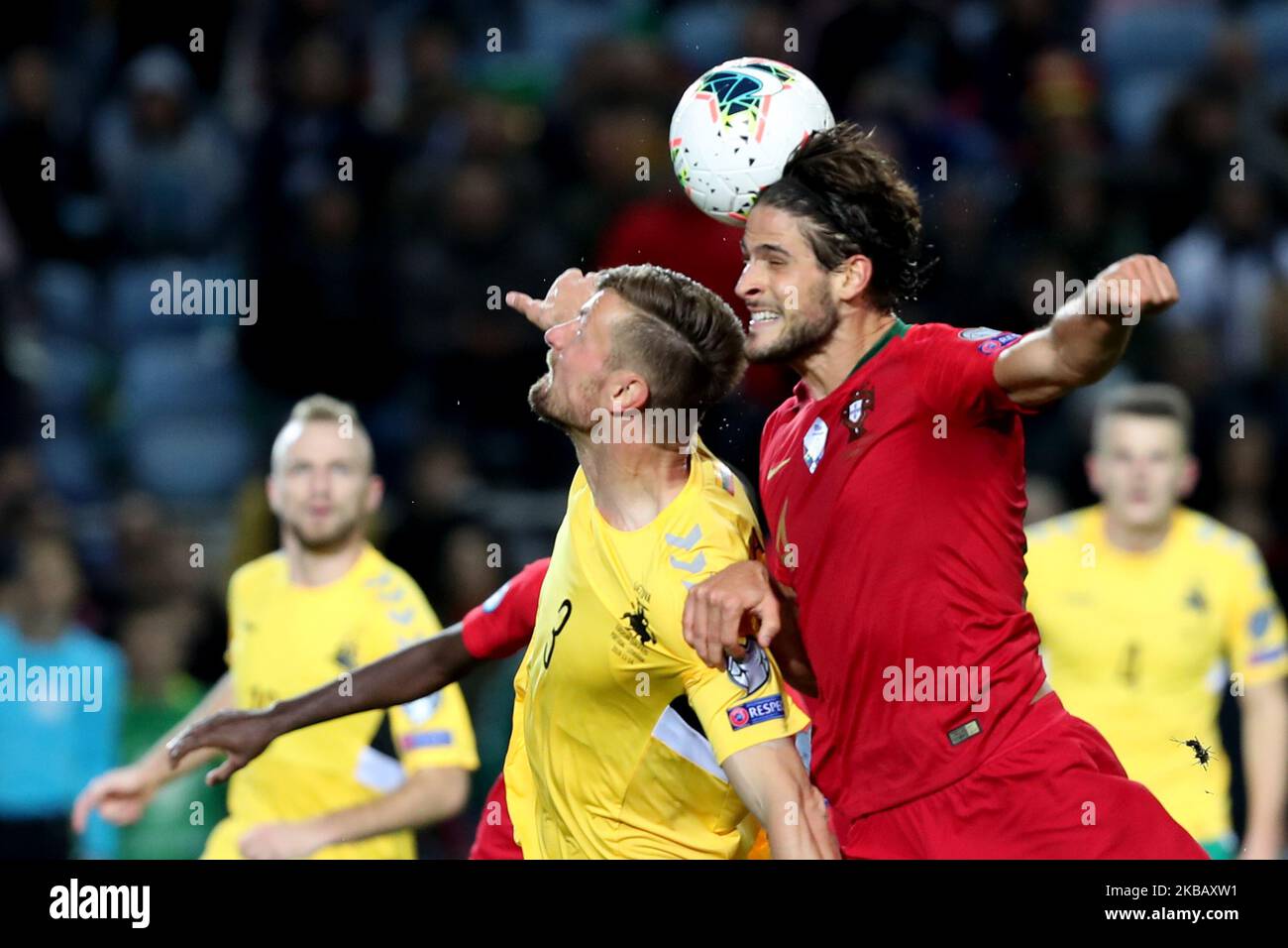 Portugal's forward Goncalo Paciencia (R ) heads the ball with Lithuania ...