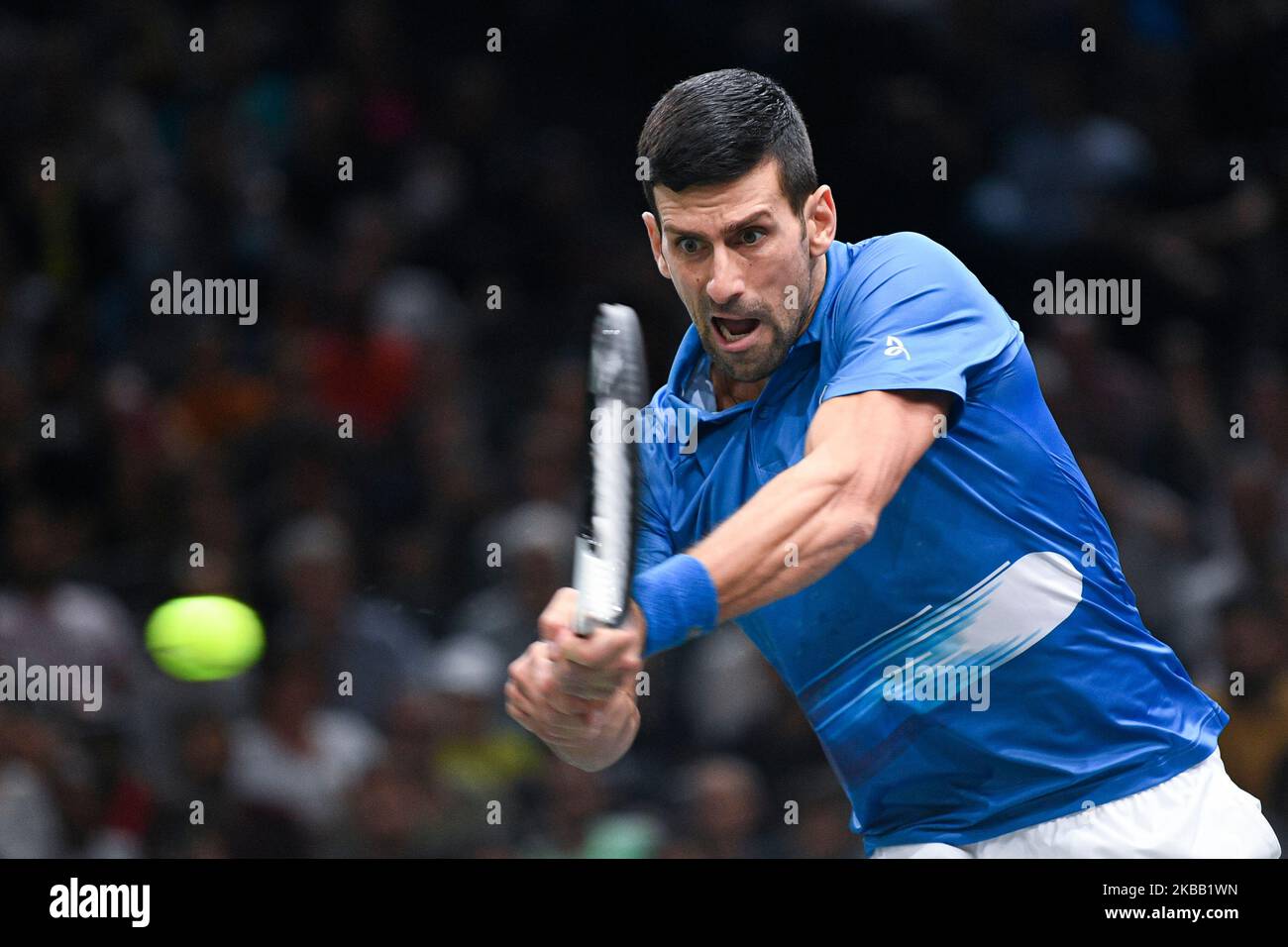 Novak Djokovic of Serbia hits a backhand during the Rolex Paris Masters ...