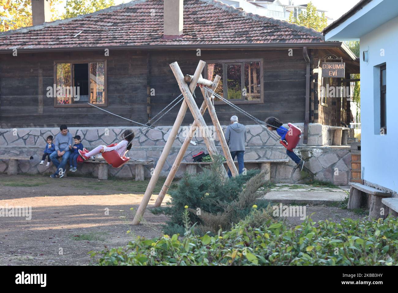 Children swing on a swing at Golden Village Open Air Museum in Ankara ...
