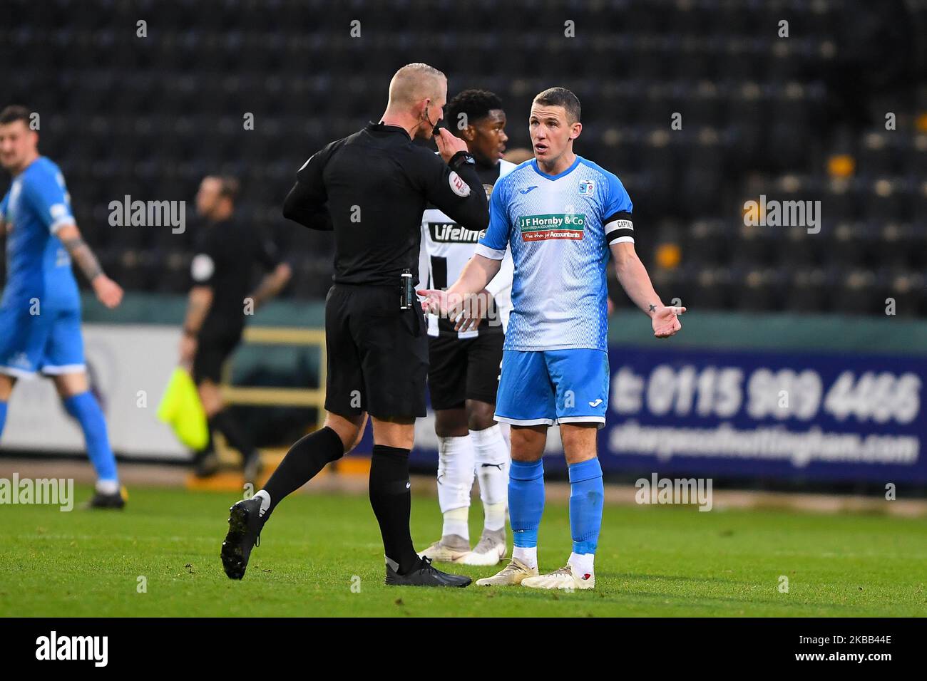 John Rooney (8) of Barrow AFC talks with Daniel Middleton during the ...