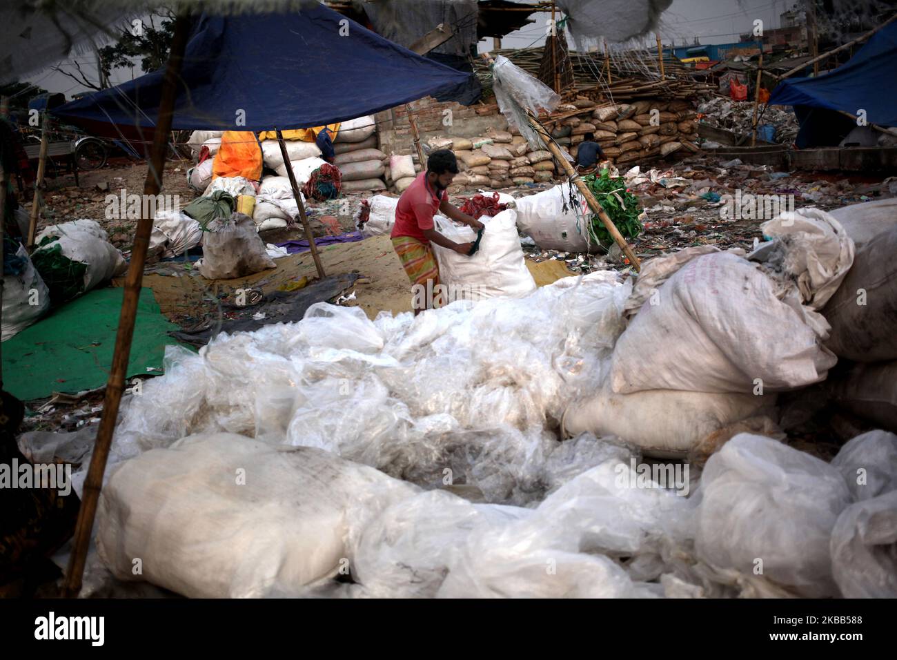 Worker seen working in a polythene recycling factory beside The ...