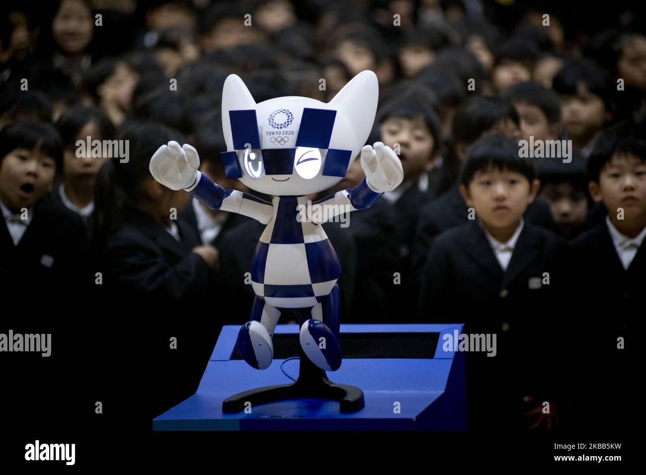 Schoolchildren pose for a picture with Tokyo 2020 Olympic Games' robot ...