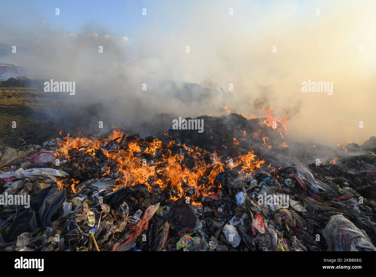 Heaps of burning rubbish at the Kawatuna rubbish landfill (TPA) in Palu ...
