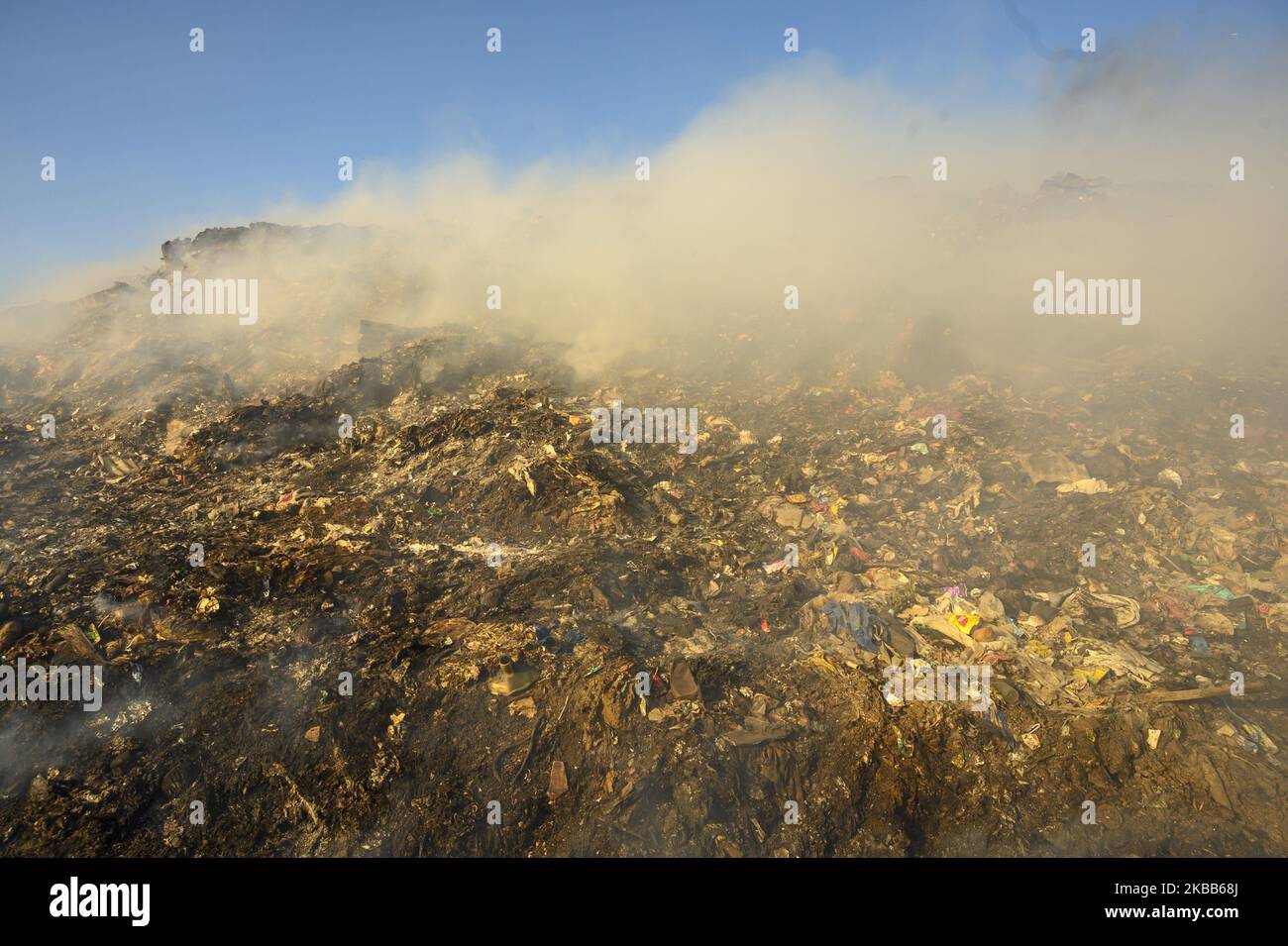 Heaps of burning rubbish at the Kawatuna rubbish landfill (TPA) in Palu ...