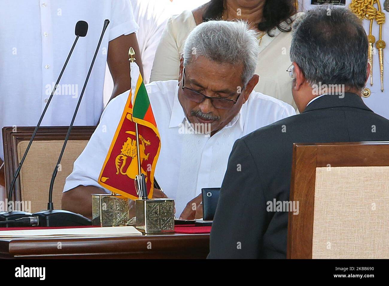 Newly elected Sri Lankan president Gotabaya Rajapaksa (center) signs ...