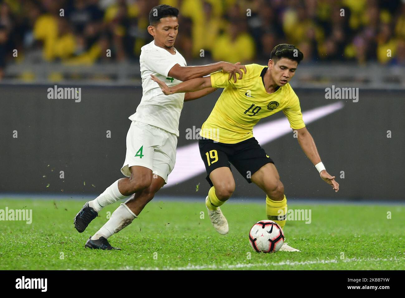 Muhammad Akhyar Rashid try to defence the ball taken by Indonesia ...