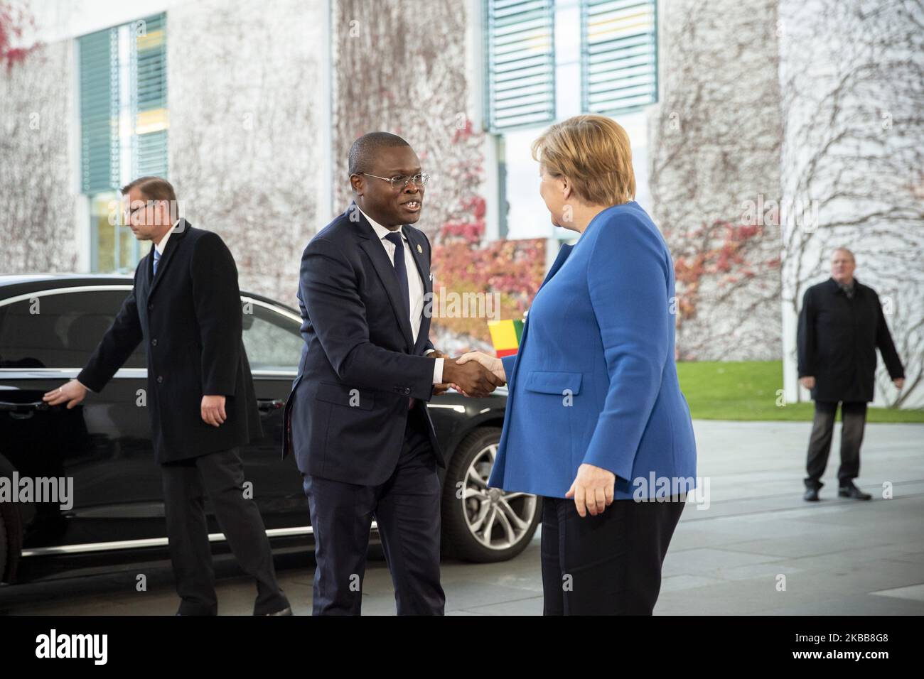German Chancellor Angela Merkel waits for dignitaries to arrive at the ...