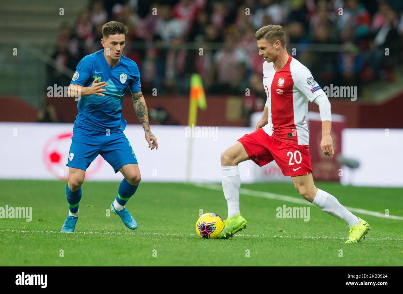 Benjamin Verbic of Slovienia vies Lukasz Piszczek of Poland in action ...