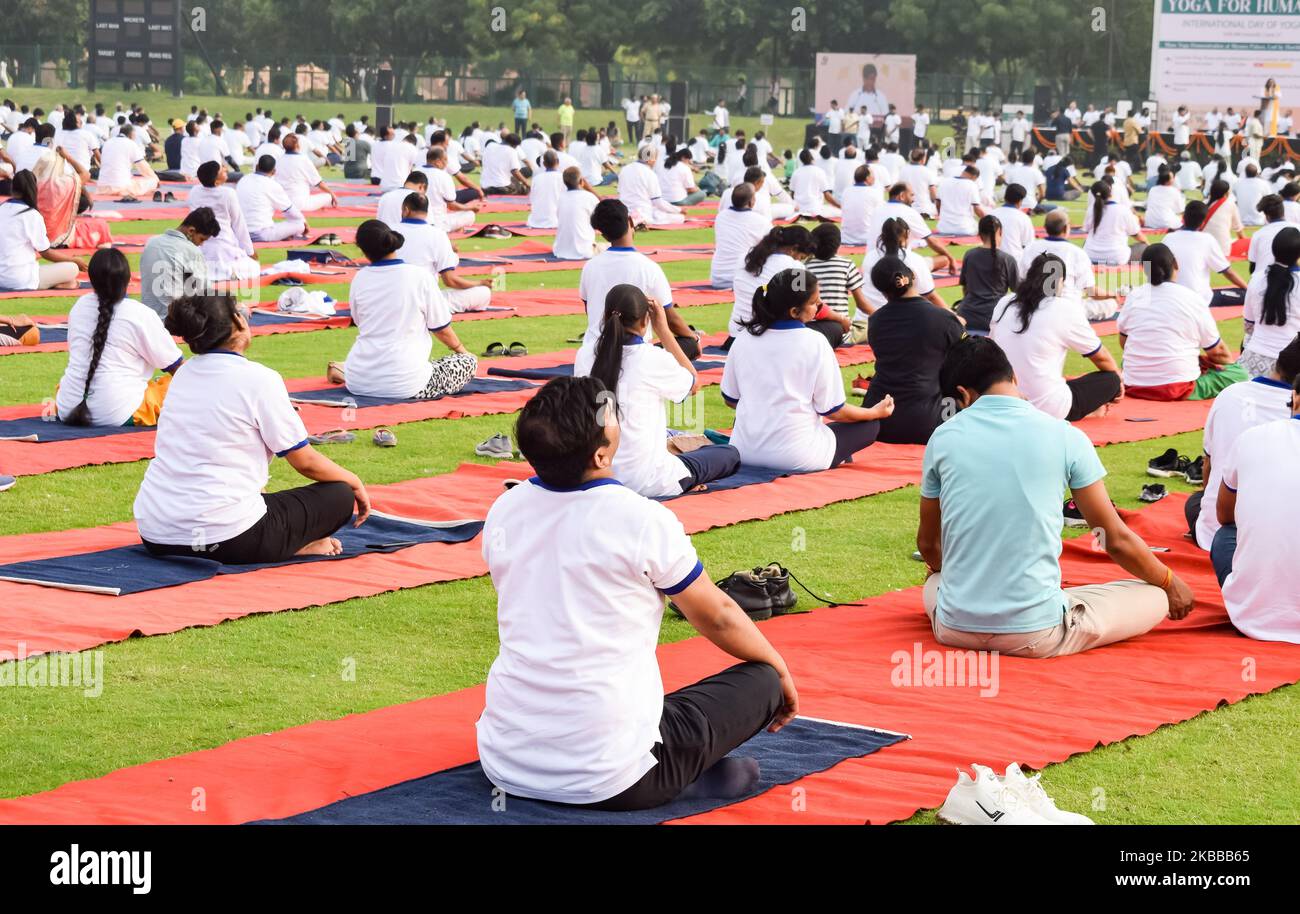 Group Yoga exercise session for people of different age groups at ...