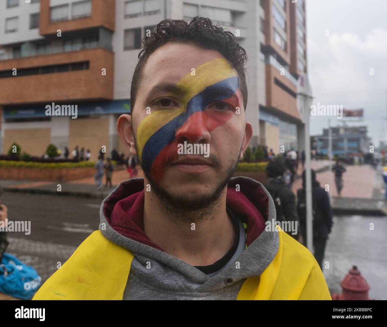 A person on his face painted with the flag of Colombia during the ...