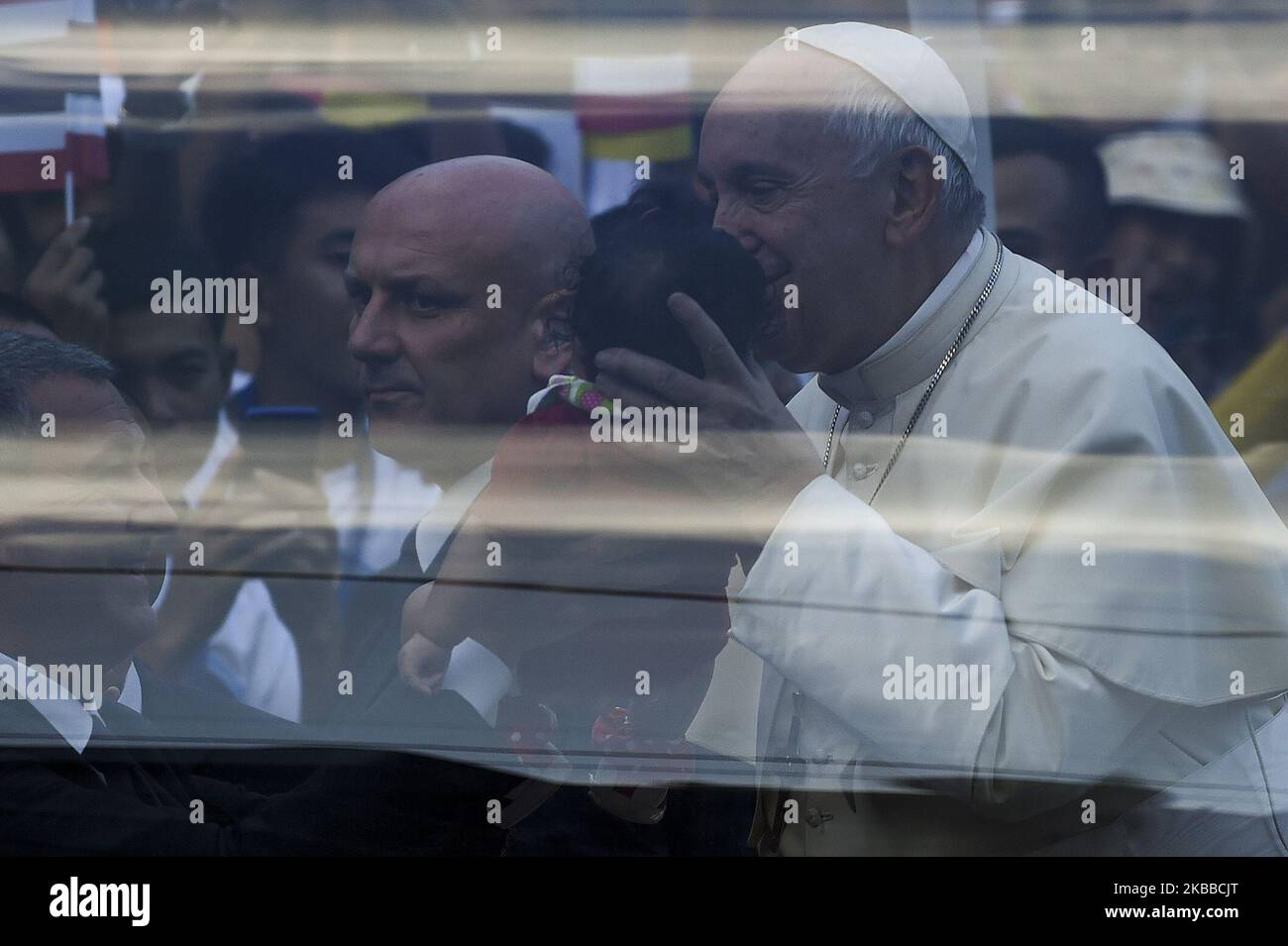 Pope Francis blesses baby as he arrives for celebrates Holy Mass ...