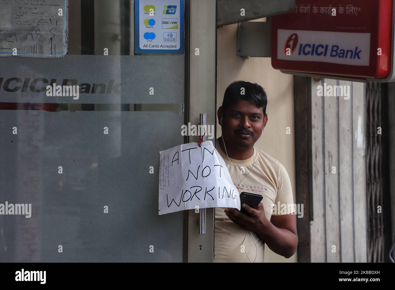 ATM not working poster is pasted outside an ICICI Bank ATM in New Delhi ...