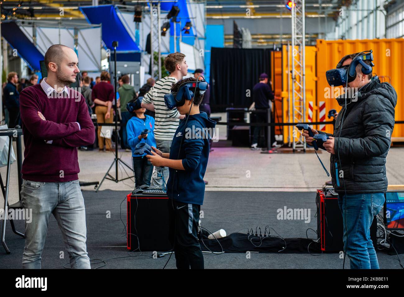 A father and his son are trying virtual reality, during the Bright Day ...