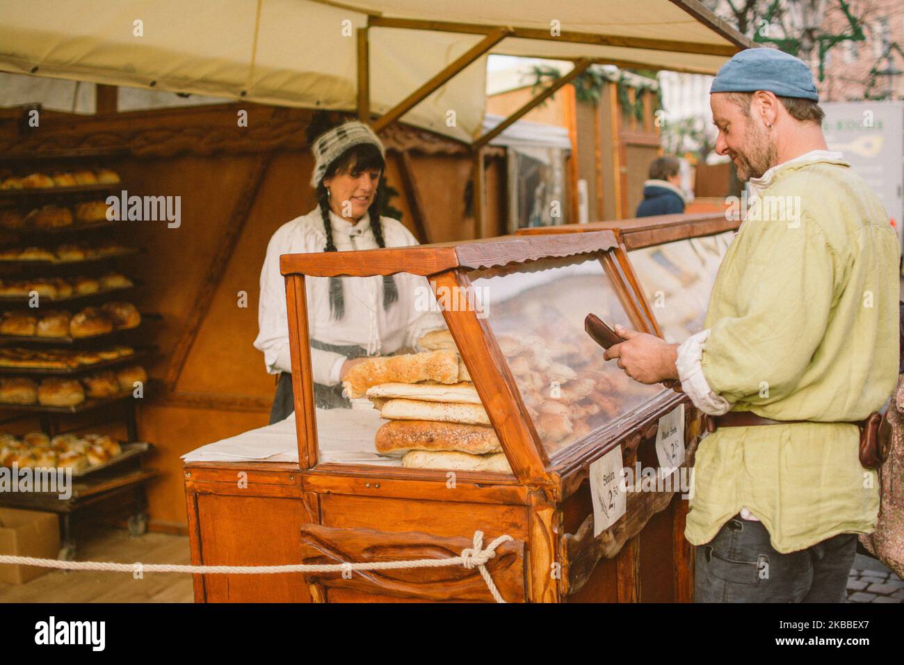 traditional baker work in her stall at the opening day of Medieval ...