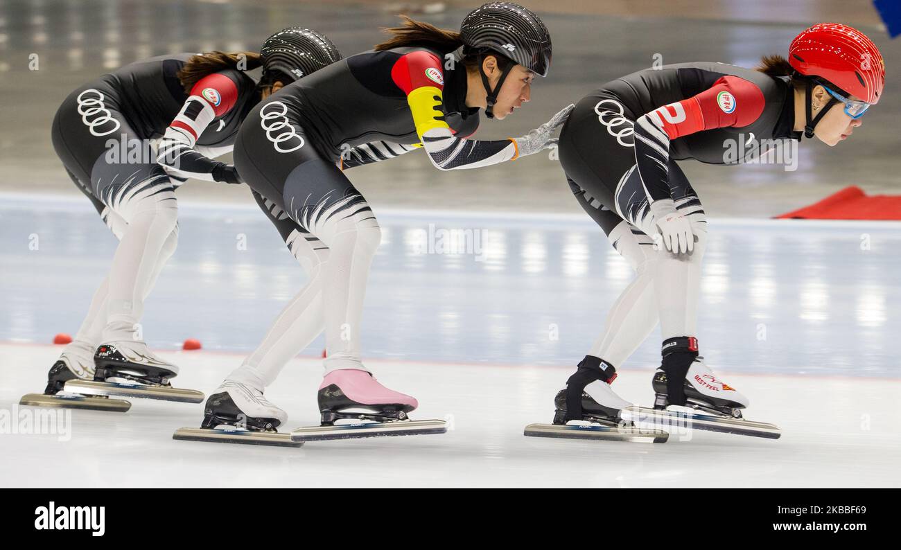 Dan Li (CHN),Jiaying Tao (CHN),Yang Zhou (CHN) compete during the ISU ...
