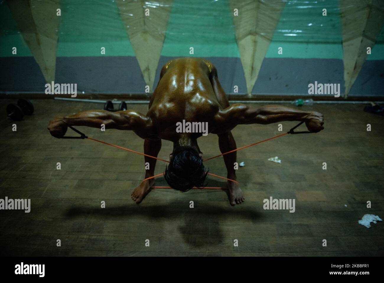 Male bodybuilding athlete prepares backstage during the 46th State and ...