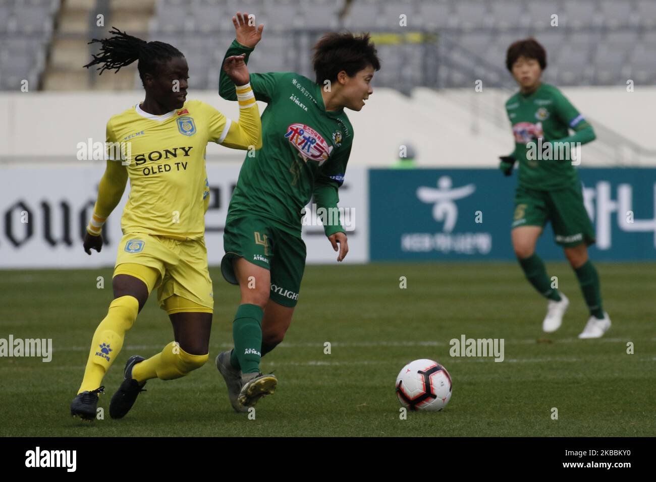 Mayo Doko of Nippon TV Beleza and Tabitha Chawinga of Jiangsu Suning Ladies Football Club action ...