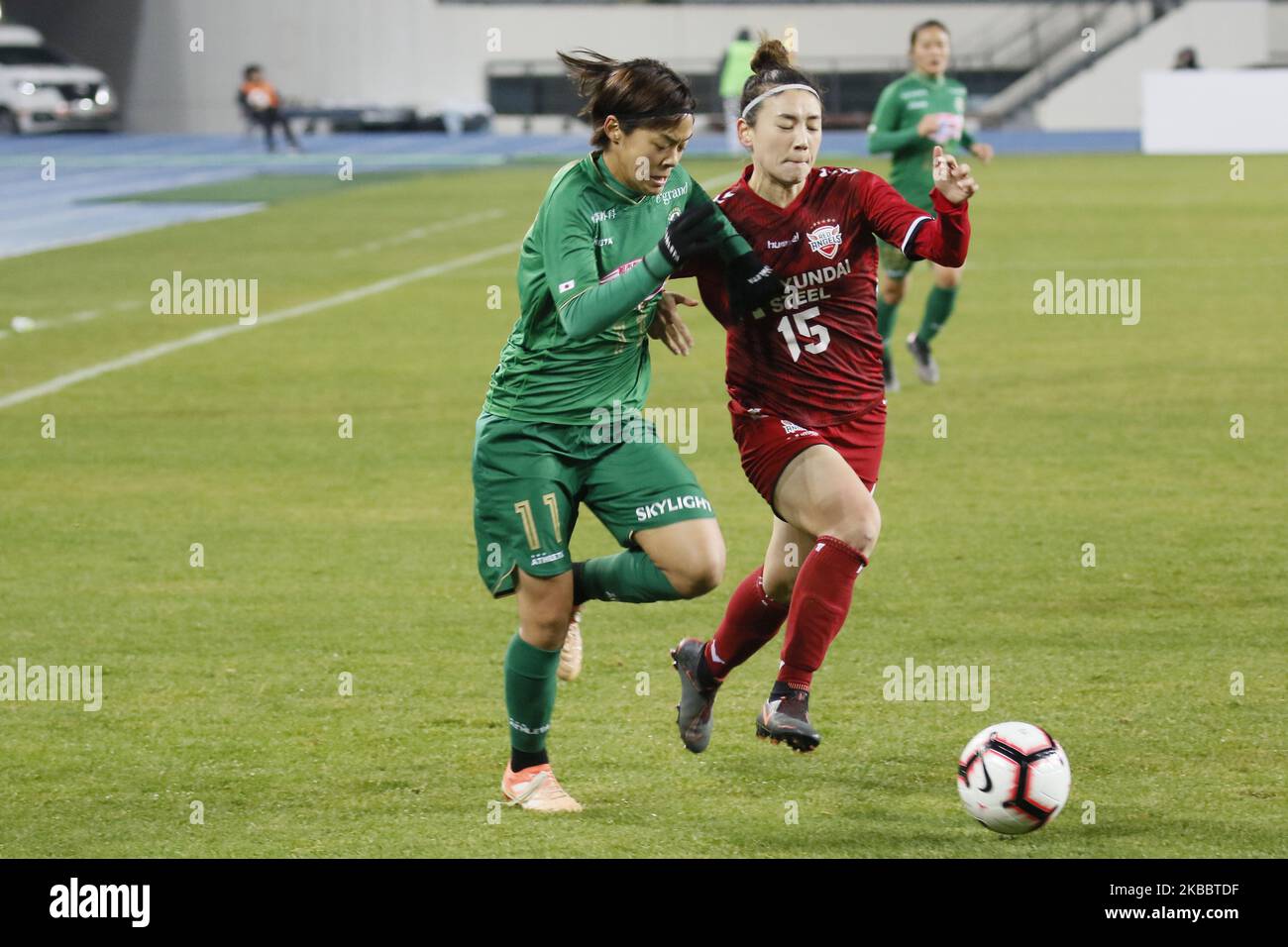 Dam-bi Kim (#15) of Hyundai Steel Red Angels of South Korea and Rikako Kobayashi (#11) of Nippon ...