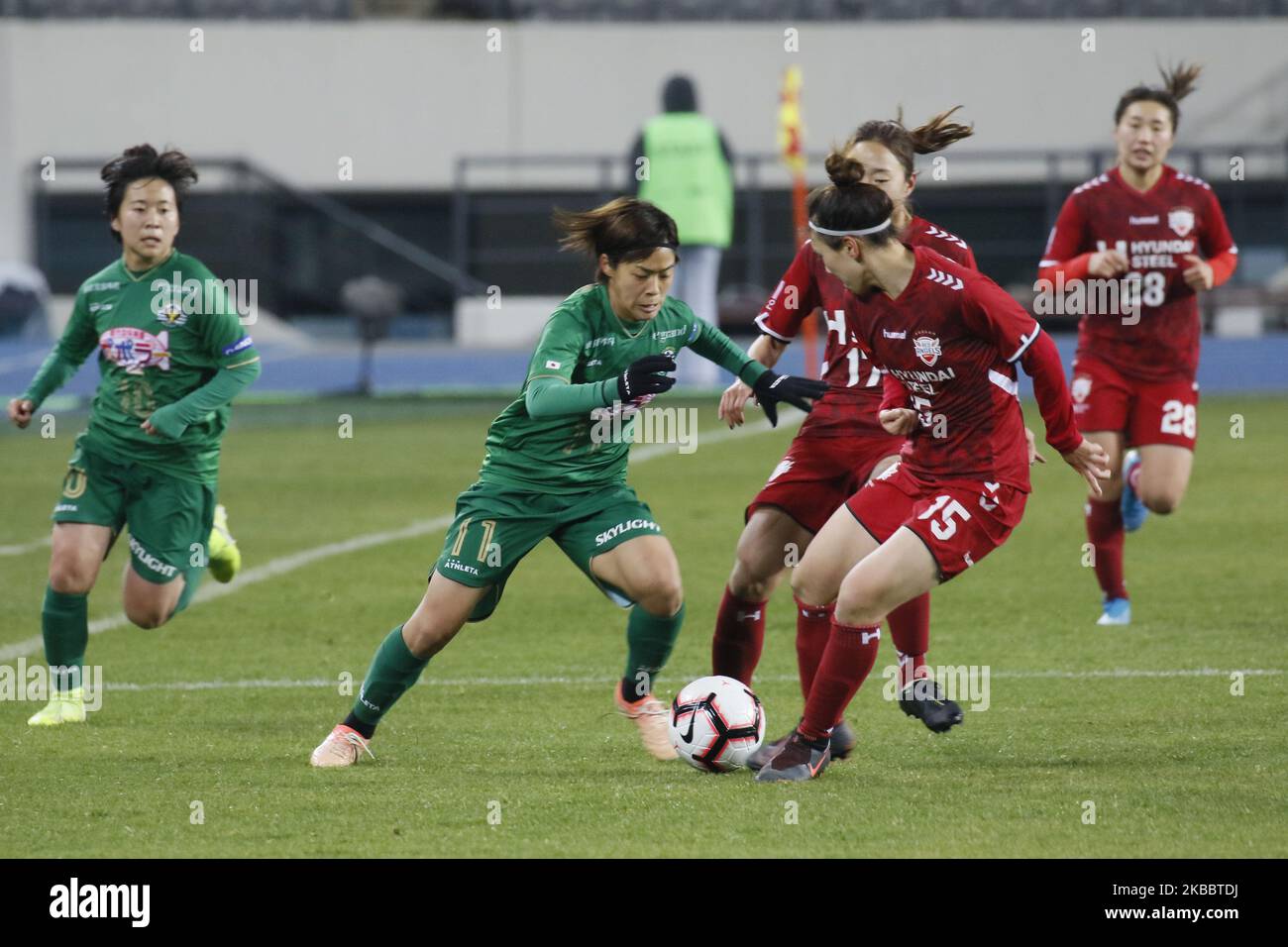 Dam-bi Kim (#15) of Hyundai Steel Red Angels of South Korea and Rikako Kobayashi (#11) of Nippon ...