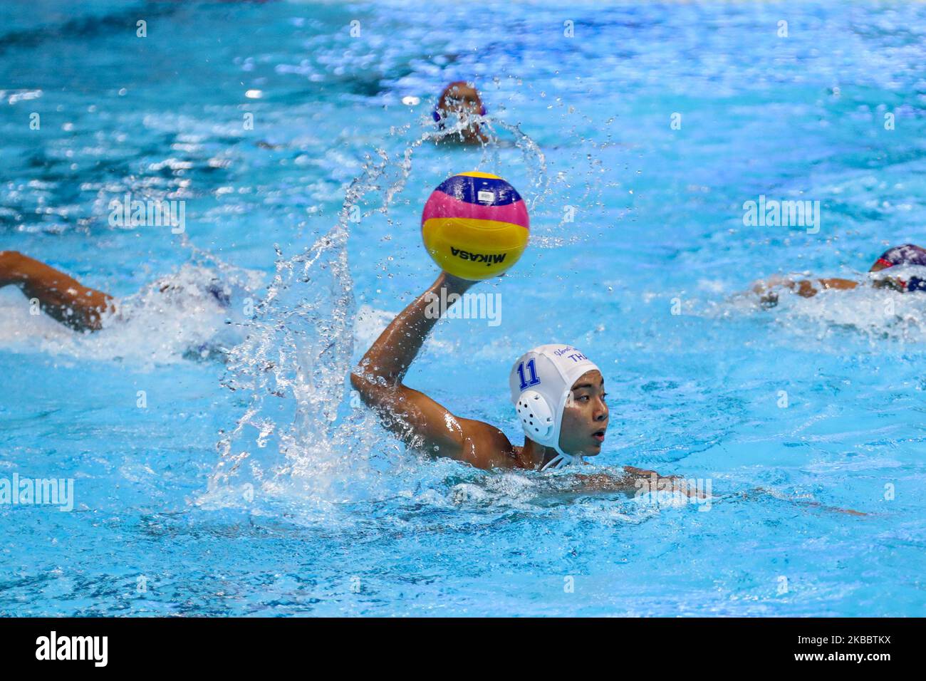 Phongsathon Chainiyom (11) of Thailand prepares to pass the ball to a teammate during their ...