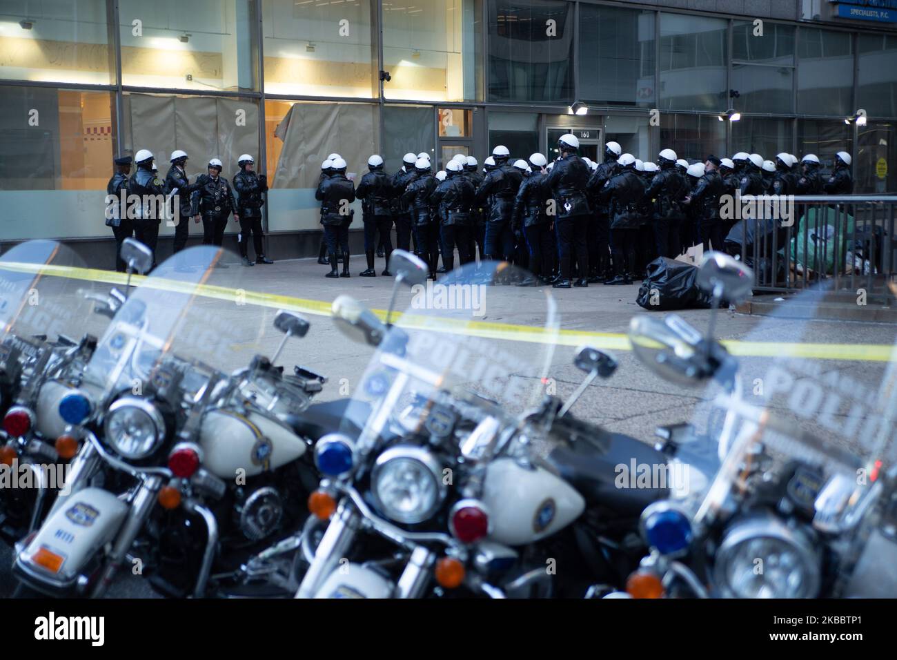 A team of motorcycle police officers prepare to secure the route for ...