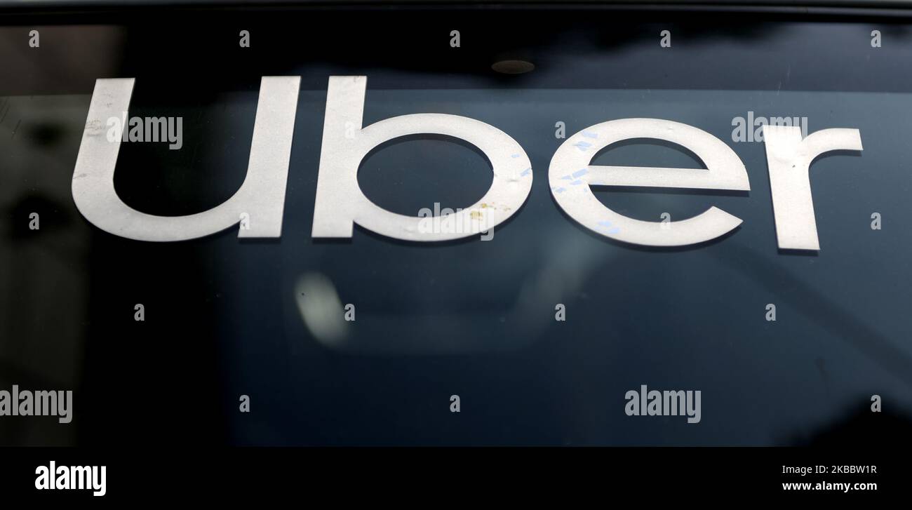 Uber logo can be seen on a windshield of an app based cab in Kolkata ...