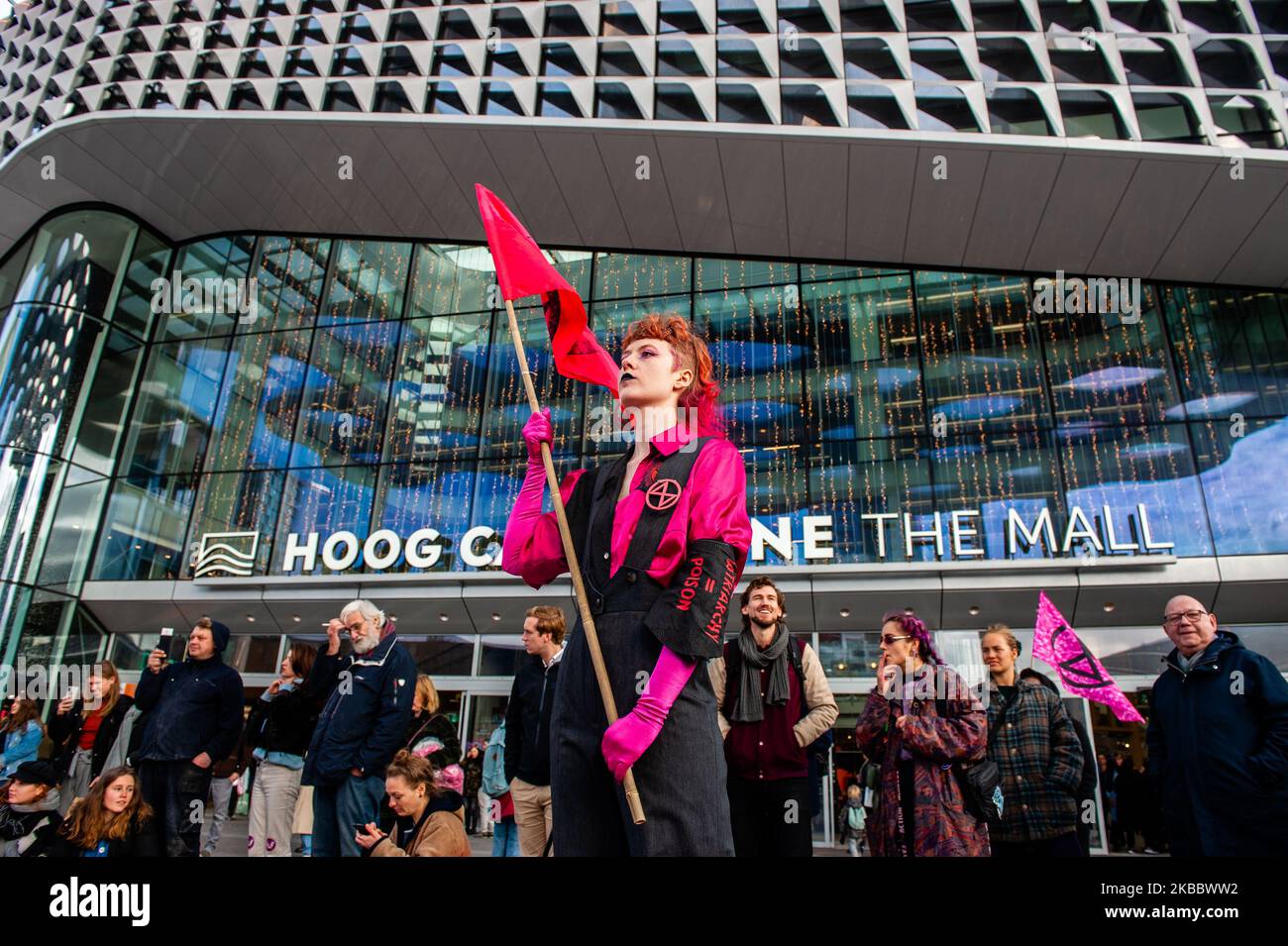 An XR model is holding an XR flag during the XR Fashion show that took ...