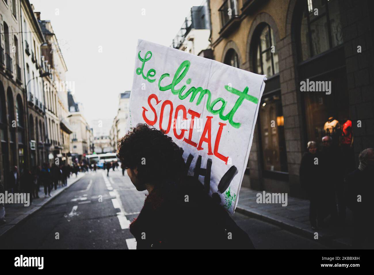 a demonstrator holding a banner in the downtown of Rennes, France at ...