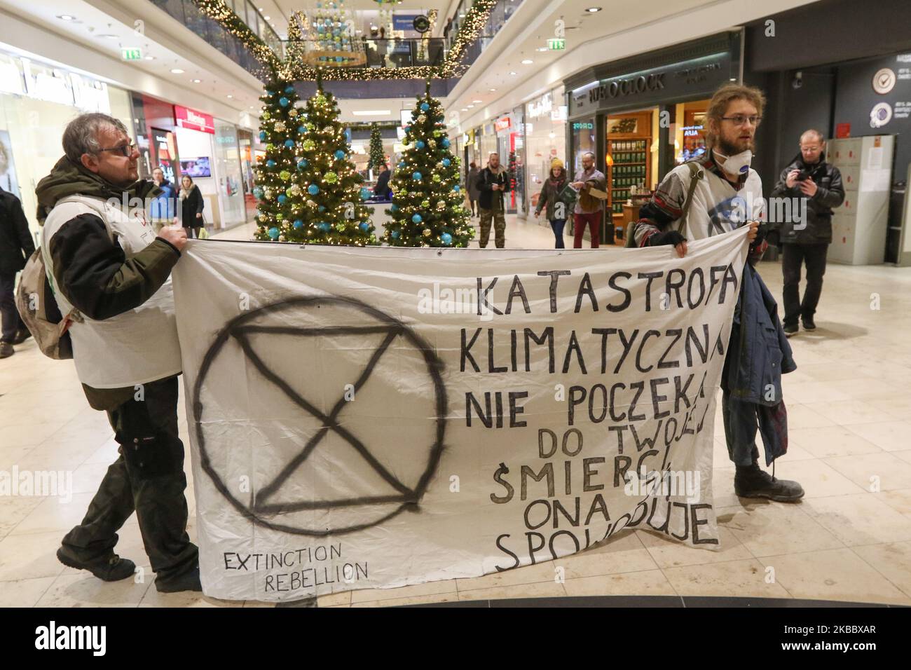 Extinction Rebellion members with banner that speaks ' A climate ...