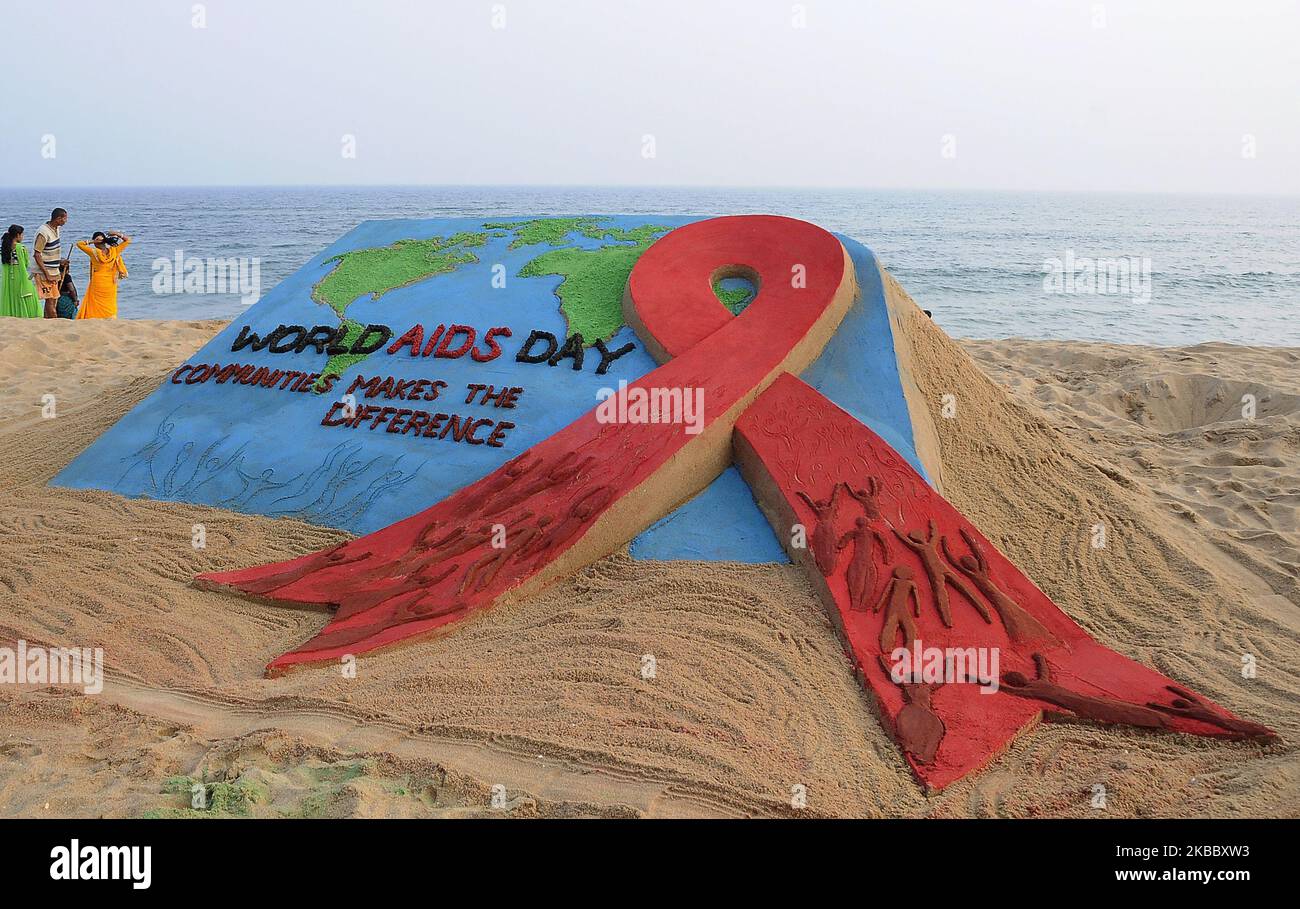 An awareness sand sculpture is seen at the Bay of Bengal Sea's eastern ...