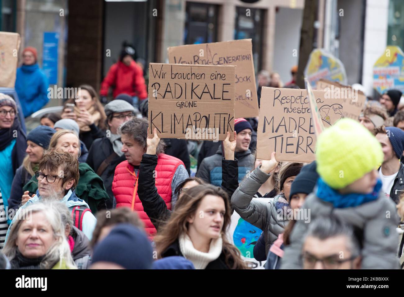 Signs reading " We need a radical green Climate policy ". As in ...