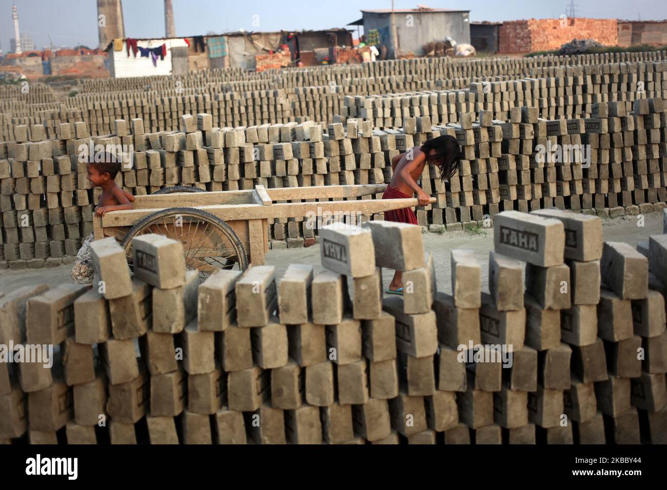 Children seen playing at a brick field beside the Buriganga river in ...
